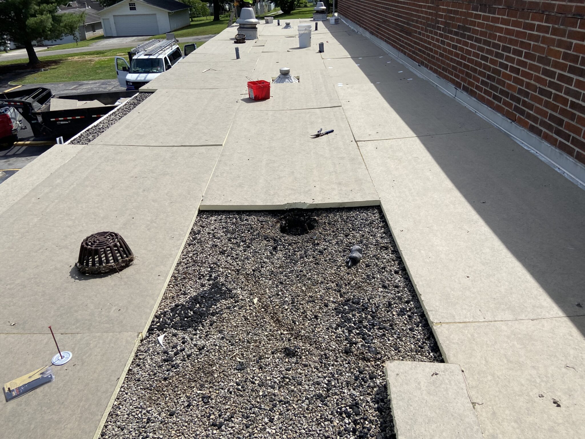 Installing Insulation Boards on Commercial Roof - Litespeed ...