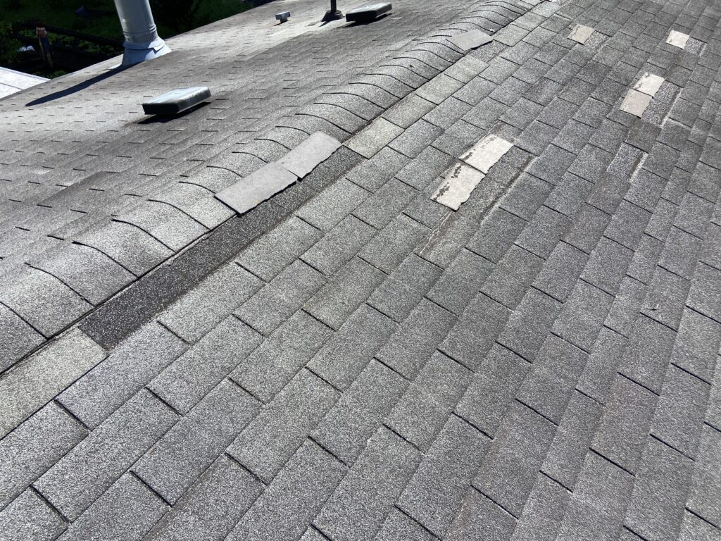 Lots Of Wind Damaged Shingles = Storm Damaged Roof